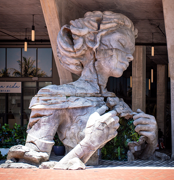 Every angle offers a different perspective on this monumental work, encouraging visitors to circle it completely, discovering new details with each step.