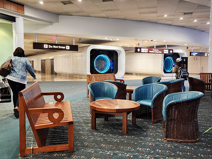 Modern lounge areas provide comfortable respite for flesh-and-blood travelers who, unlike our bronze friend, eventually need to move.