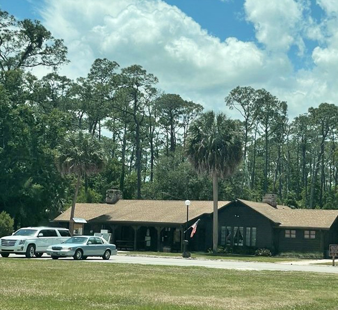 The park's welcoming headquarters stands ready to introduce visitors to Florida's wild side, surrounded by protective pines.