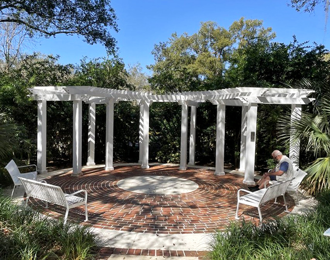 The garden's pergola offers a shaded retreat where visitors can rest and reflect on the perfect marriage of horticulture and imagination.
