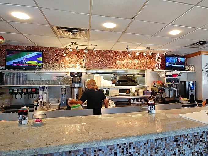Behind every great meal is a kitchen ballet of precision and timing. The prep station gleams with promise, like the backstage of a Broadway show about to begin.