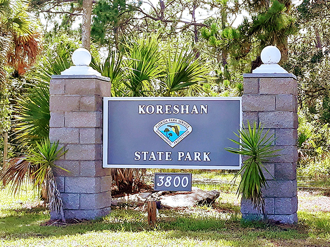 The park entrance sign – where modern visitors begin their journey into one of Florida's quirkiest historical rabbit holes.