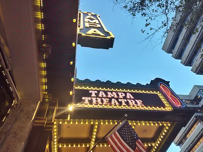 The vertical "TAMPA" sign has guided generations of moviegoers like a lighthouse of entertainment, beckoning with the warm glow of nostalgia.