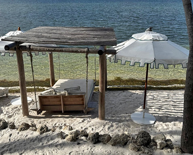 A swinging daybed suspended in paradise &ndash; where afternoon naps become transcendental experiences worth writing home about.