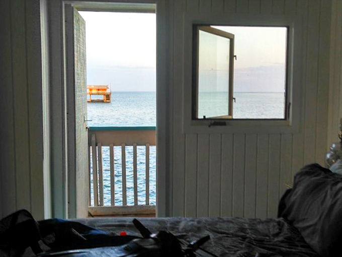 Through this window, the morning view isn't of neighboring houses or busy streets, but endless blue horizons and the occasional curious seagull.