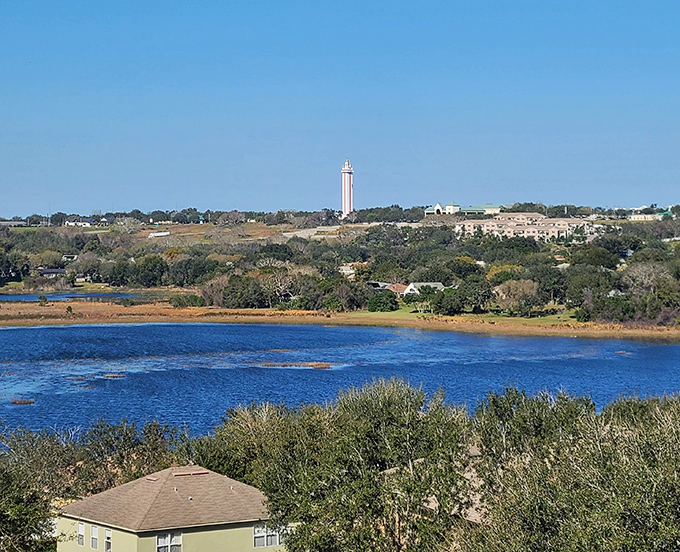 The tower punctuates the horizon like an exclamation point on the landscape, visible across the lake and announcing "Something special is here!"