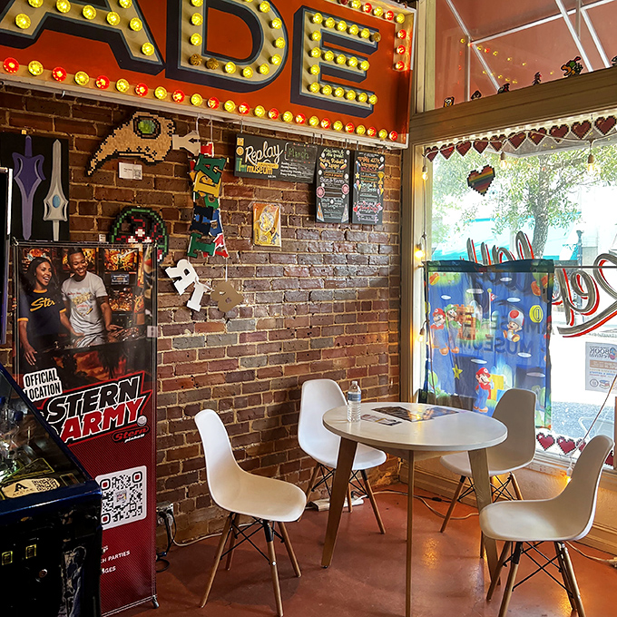 A cozy seating area invites gamers to rest between sessions, swap strategies, or simply watch others tackle the classics with fresh determination.