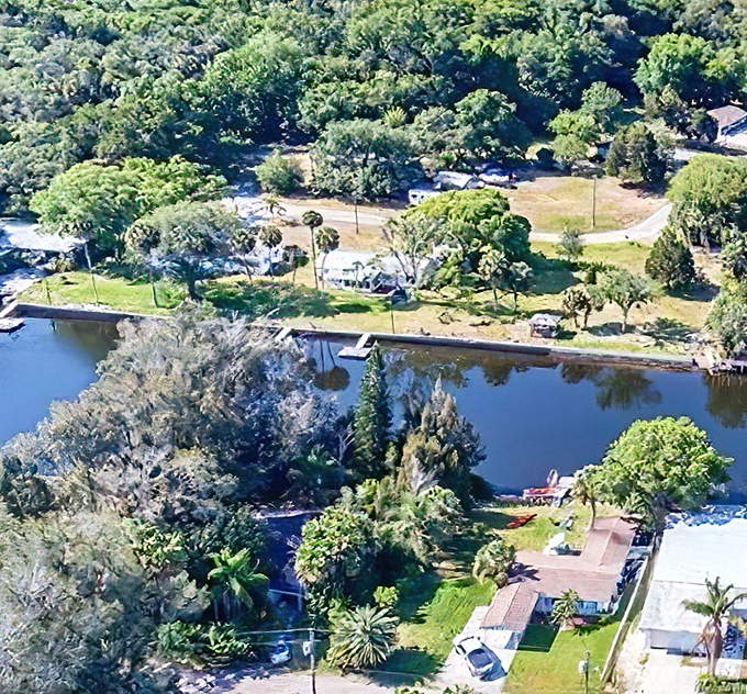 Bird's eye view reveals Aripeka's perfect balance &ndash; water, wilderness, and modest homes coexisting in environmental harmony.