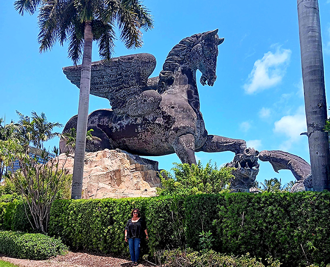 Another visitor provides scale to this towering achievement in public art. Some Florida souvenirs are photos&mdash;this one is a memory.