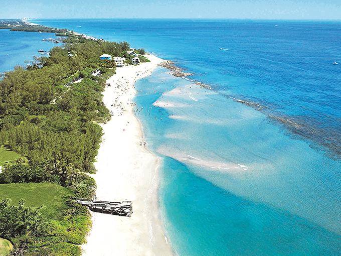 Nature's perfect swimming pool forms where protective reefs calm the Atlantic waves, creating a family-friendly paradise of shallow turquoise waters.