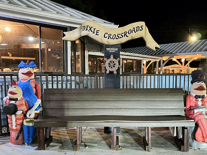 This whimsical outdoor bench flanked by fish sculptures invites weary travelers to rest a spell before diving into seafood paradise.