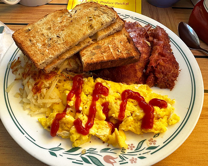 Breakfast of champions! Eggs, hash browns, toast, and bacon &ndash; the fantastic four of morning meals, with ketchup art for good measure.