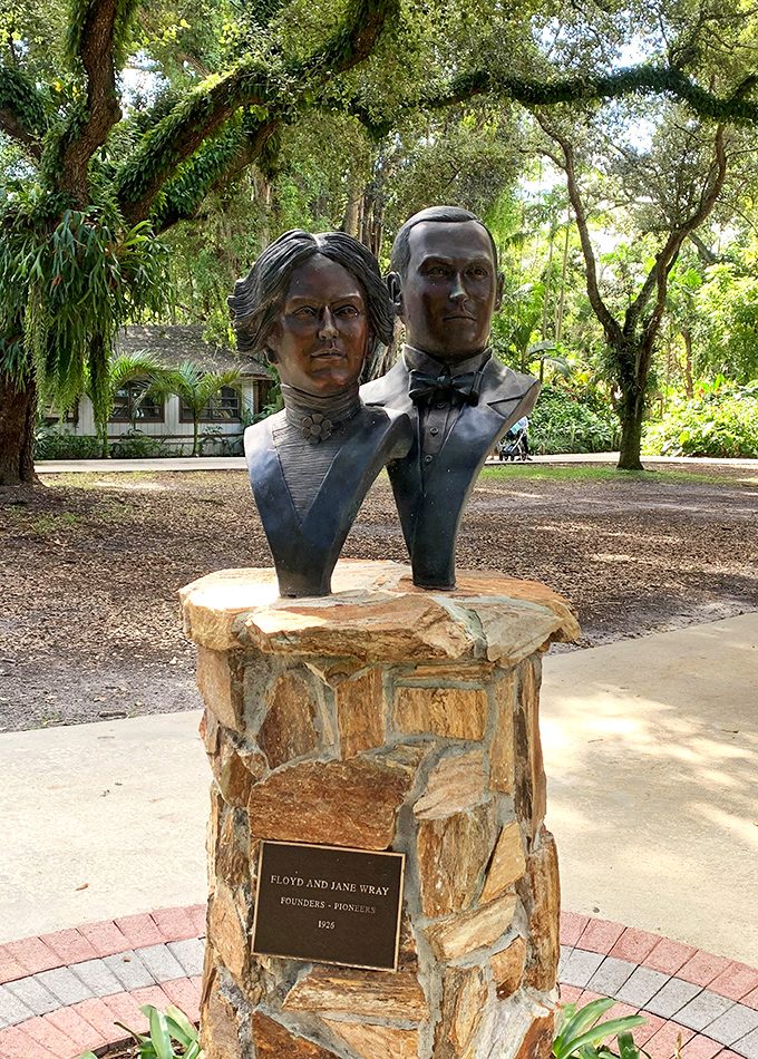 History cast in bronze: The garden founders' likenesses stand watch over their living legacy, a testament to vision that transformed Florida farmland into paradise.