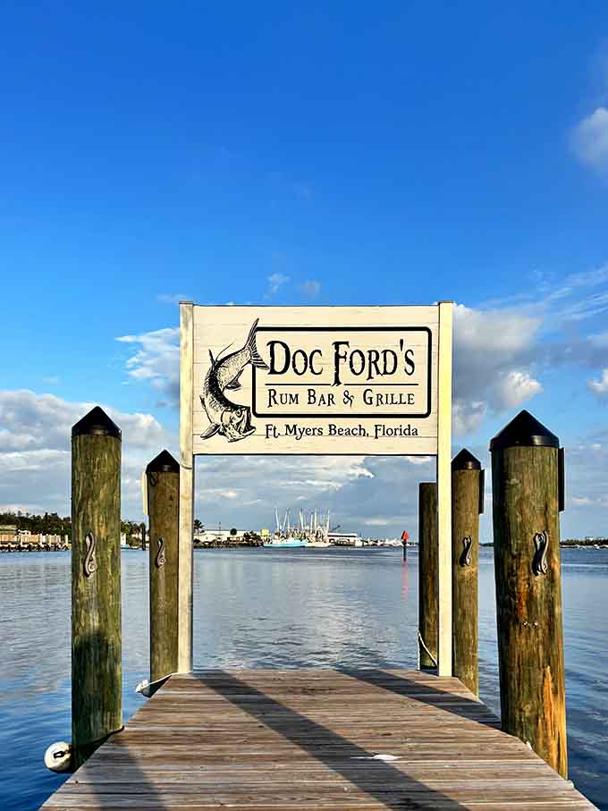 The dock sign frames the perfect photo op, announcing your arrival at a place where good food and good times intersect.