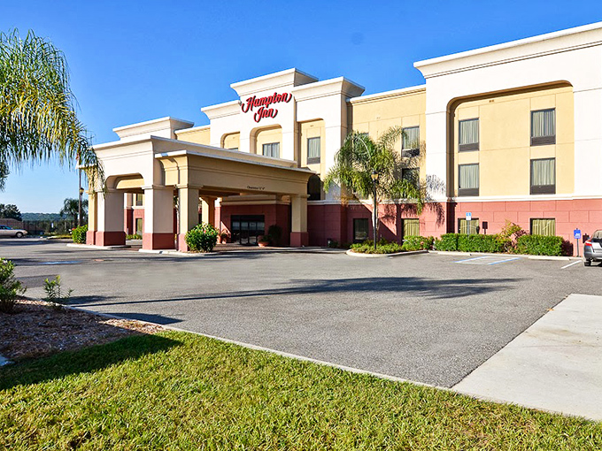 The Hampton Inn provides familiar comfort for weary travelers exploring Dade City's charms, palm trees nodding welcome in the breeze.