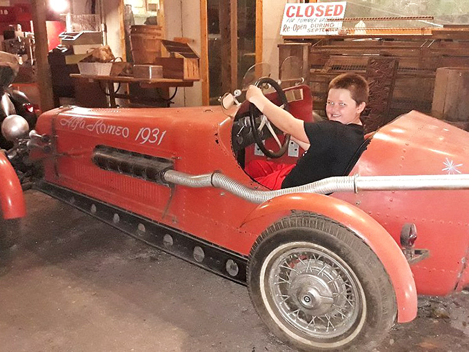 "Alfa Romeo 1931" reads the vintage vehicle where young driver can pretend they're racing through the Italian countryside instead of standing still in Florida.