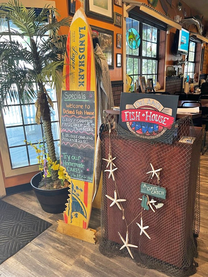 The entrance greets visitors with a perfect snapshot of Old Florida charm &ndash; surfboard, fishing net, and the promise of fresh seafood within.