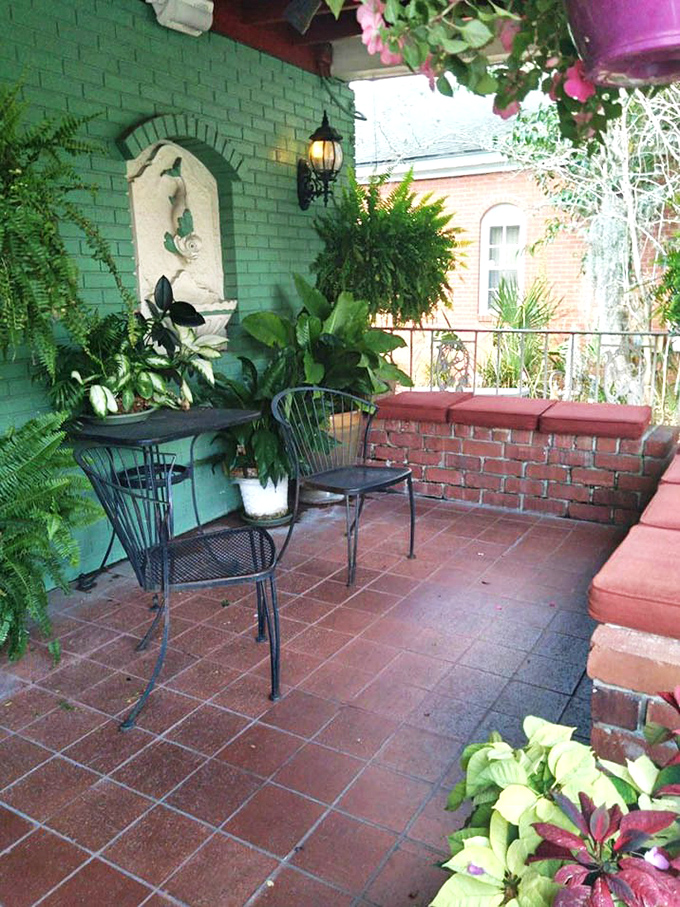 The plant-filled patio offers a tranquil outdoor dining option where the Florida breeze complements the homestyle cooking perfectly.