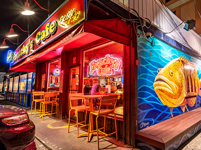 As evening approaches, Frenchy's neon glow beckons hungry souls to experience Florida's seafood legacy in this unassuming coastal gem.