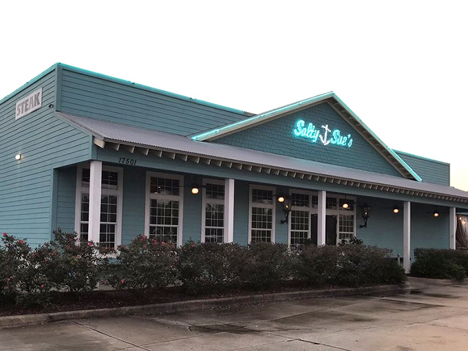 As evening approaches, Salty Sue's glows with invitation &ndash; a turquoise haven of flavor on Panama City Beach Parkway.