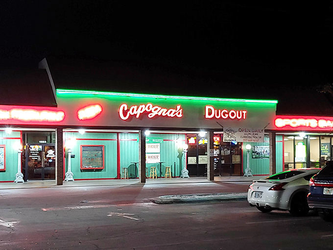 When night falls, the neon signs transform Capogna's into a beacon of culinary comfort, drawing food lovers like moths to a delicious flame.