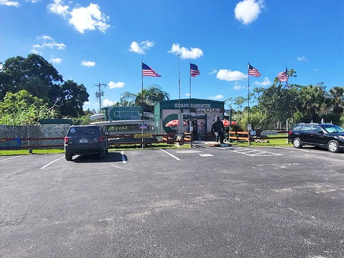 American flags flutter above the headquarters entrance, because searching for mysterious swamp creatures is apparently a patriotic endeavor.