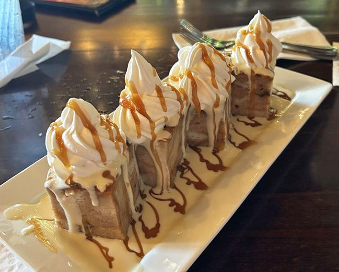 Plantain bread pudding topped with whipped cream peaks and caramel drizzle &ndash; a dessert that transforms humble ingredients into sweet poetry.