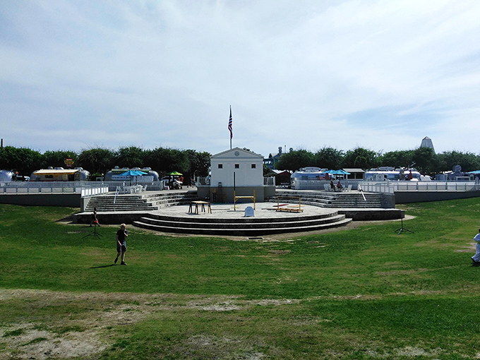 The amphitheater creates Seaside's social heart, where community gatherings happen against a backdrop of swaying palms and Gulf breezes.
