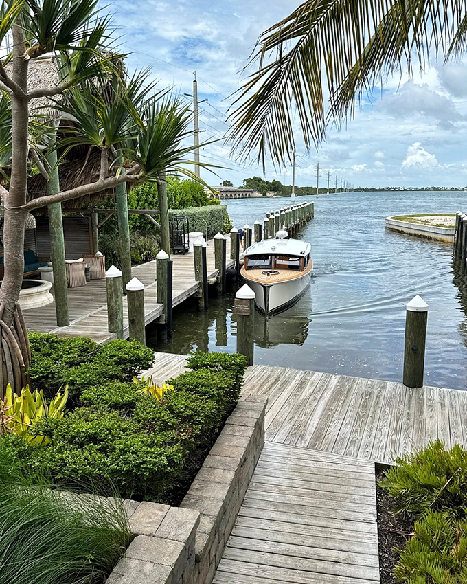The meticulously maintained dock extends into the water like a runway for arriving boats and departing worries.
