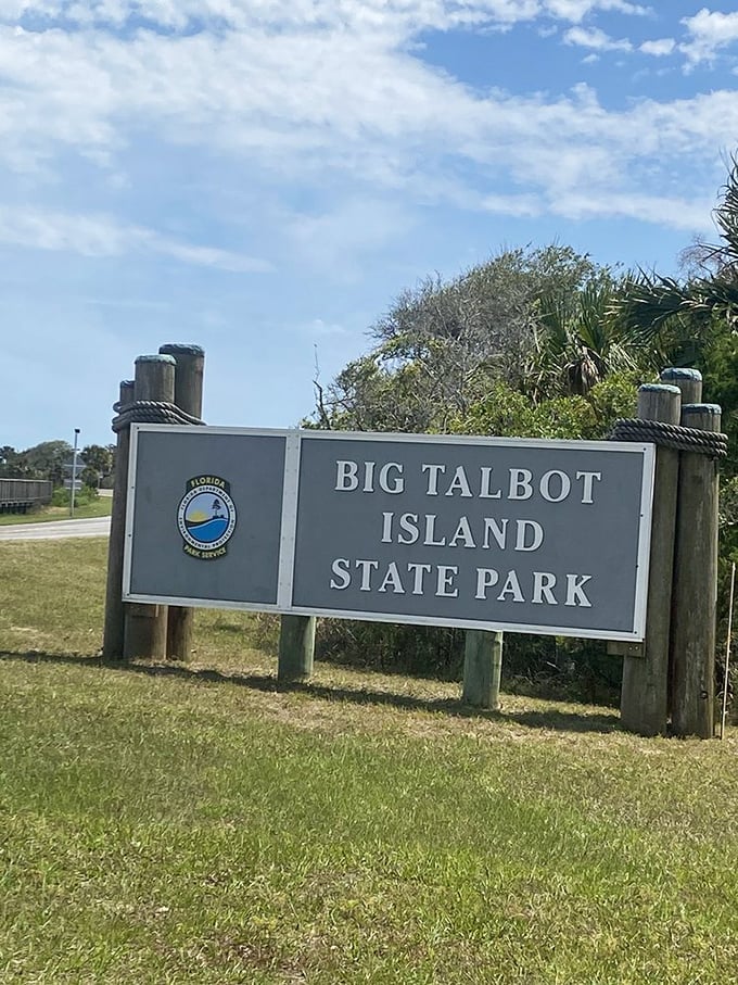 The official welcome sign stands sentinel at the park entrance, promising adventures that Instagram filters simply cannot improve upon.