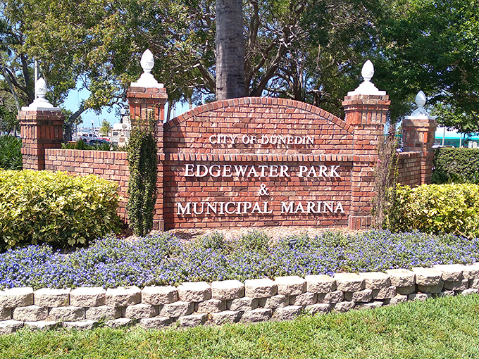 Edgewater Park's brick entrance sign promises exactly what it delivers: a waterfront escape where everyday worries dissolve into the horizon.