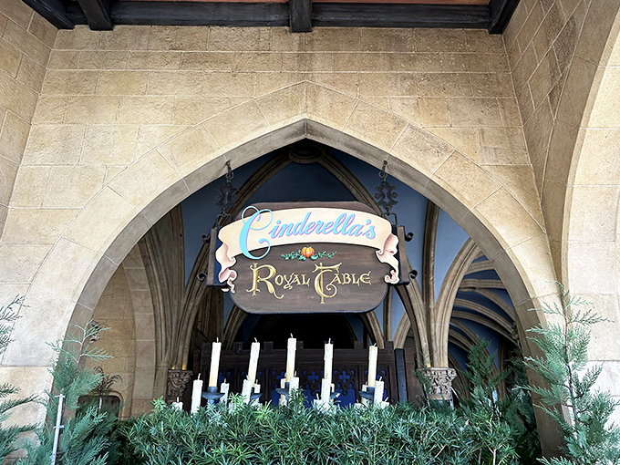 The iconic Cinderella's Royal Table sign marks the entrance to one of Disney World's most sought-after dining experiences.