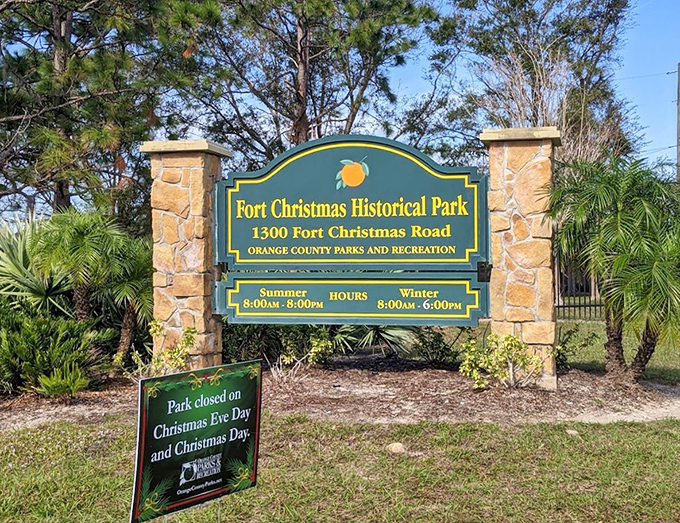 The entrance sign welcomes modern explorers to Fort Christmas Historical Park, where Florida's past patiently waits behind stone pillars and native palms.