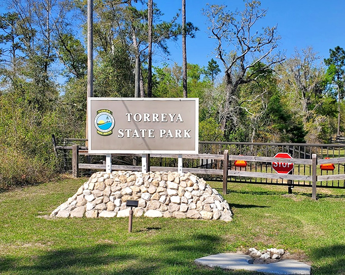 The park entrance sign promises adventure beyond &ndash; like the wardrobe to Narnia, but with more humidity and fewer talking lions.