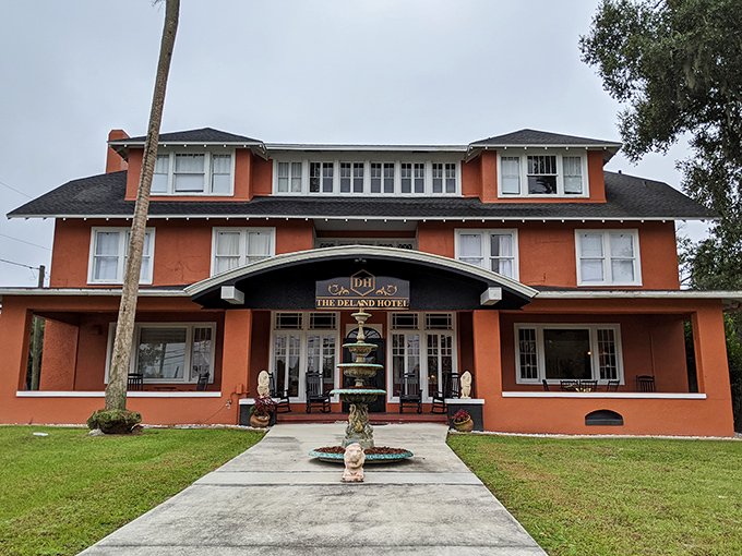 The DeLand Hotel's terracotta facade and welcoming fountain stand as testaments to the town's historic hospitality tradition that continues to this day.