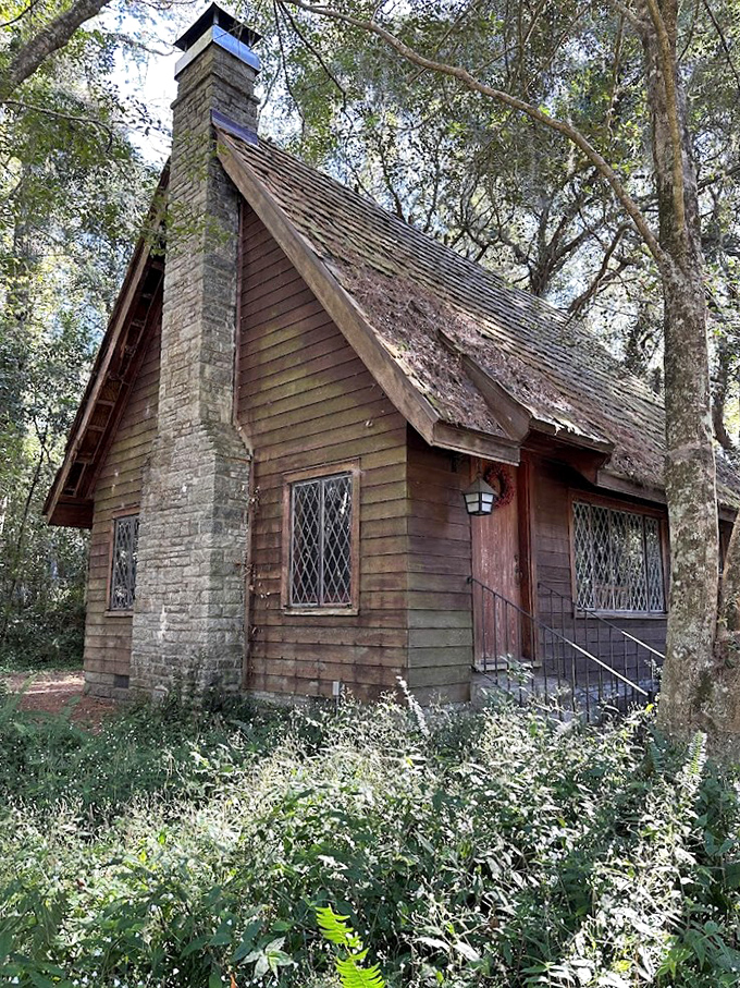 The storybook Tudor cottage seems plucked from an English countryside, its chimney and diamond windows defying Florida's landscape.