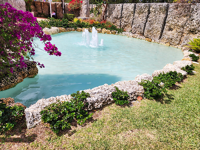 So refreshing! The turquoise water of this charming, rock-rimmed fountain contrasts beautifully with the lush pink flowers.