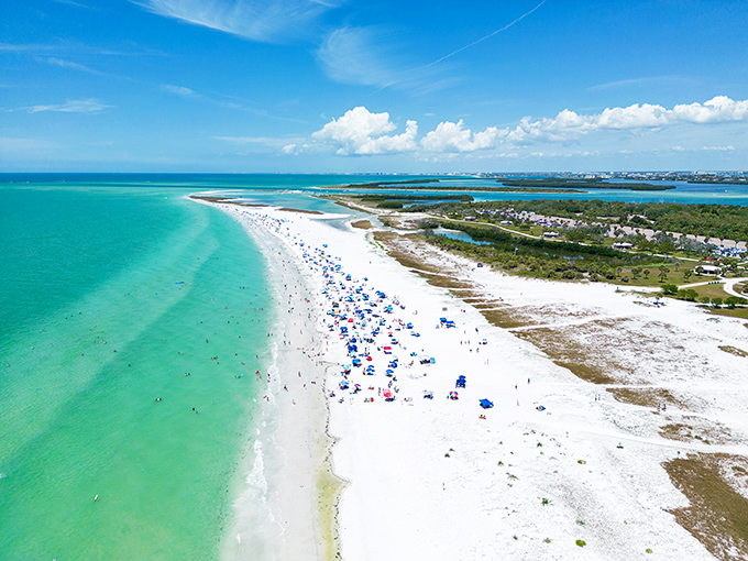 Paradise from above reveals the true artistry of nature's design &ndash; a perfect crescent of white sand embraced by waters of impossible blue.