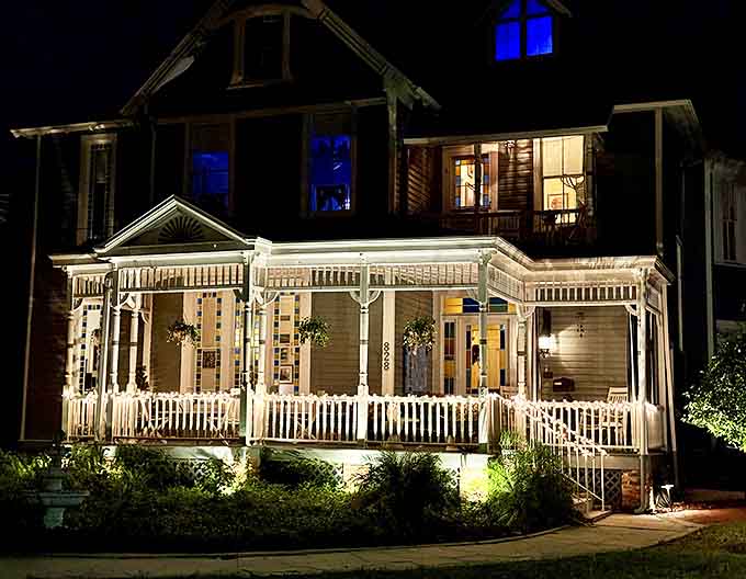 As darkness falls, the Seven Sisters Inn glows with warm light, creating a magical atmosphere where the veil between past and present grows delightfully thin.