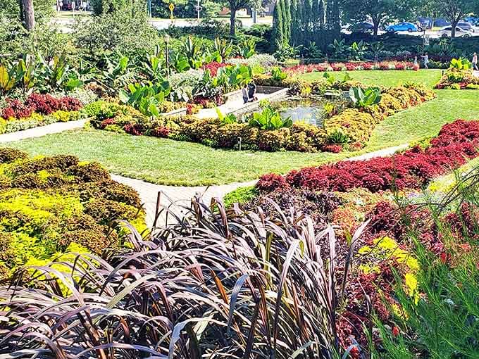 Meticulously maintained garden beds create living artwork, their colorful plantings forming patterns that can only be fully appreciated from above.