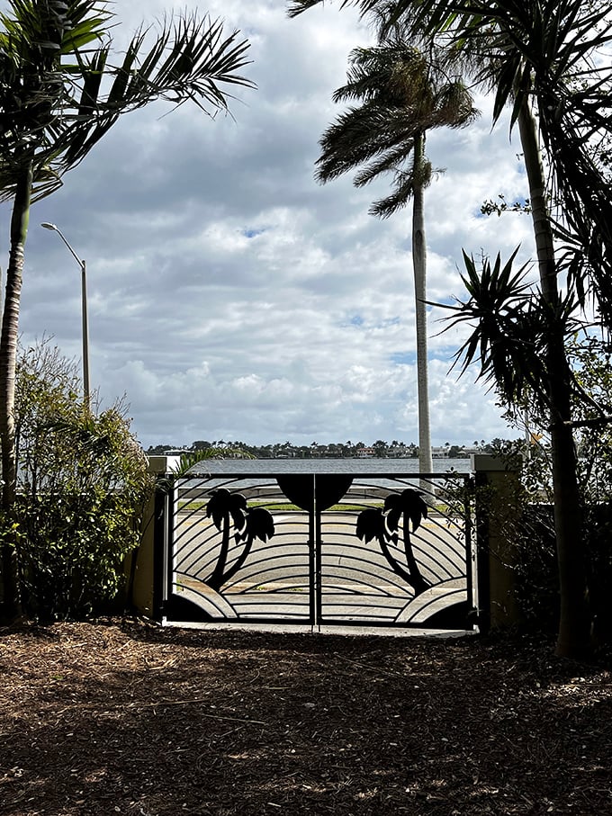 Palm-adorned gates frame the view beyond, promising adventure while bidding a temporary farewell to the outside world.