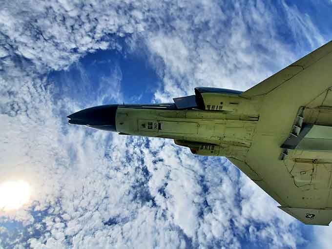 Looking up at history from below, where Florida clouds frame a machine that once danced among them.
