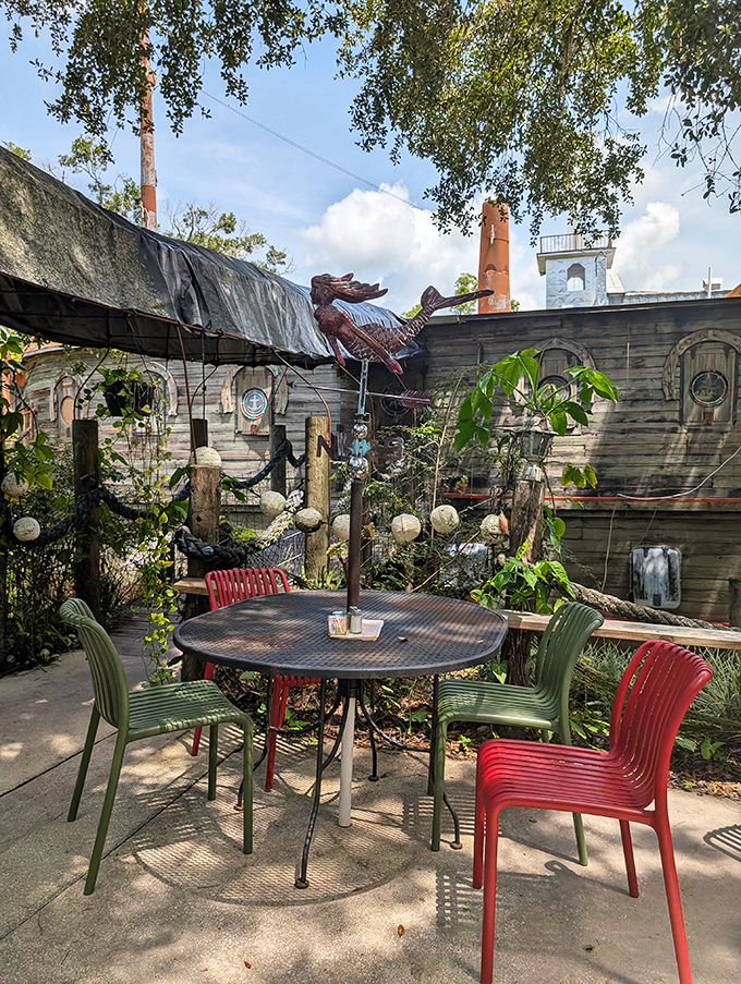 The outdoor seating area offers a different perspective of the boat restaurant, perfect for enjoying Florida weather and contemplating nautical impossibilities.