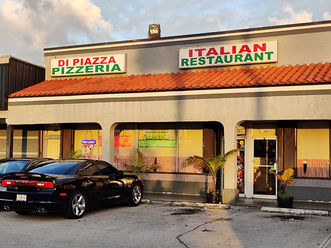 As evening falls, the restaurant's exterior takes on a golden glow &ndash; a beacon for those seeking authentic Italian comfort in Hialeah.