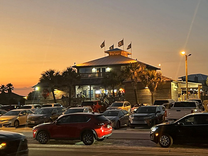 As dusk settles, Peg Leg Pete's glows like a lighthouse for hungry souls &ndash; the parking lot filling with those seeking their seafood fix under starlit skies.
