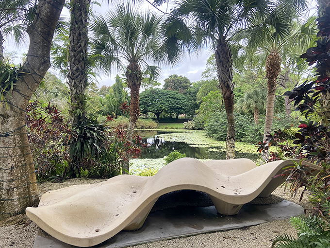 This undulating concrete bench offers a perfect resting spot with a view, proving even seating can be an artistic statement.