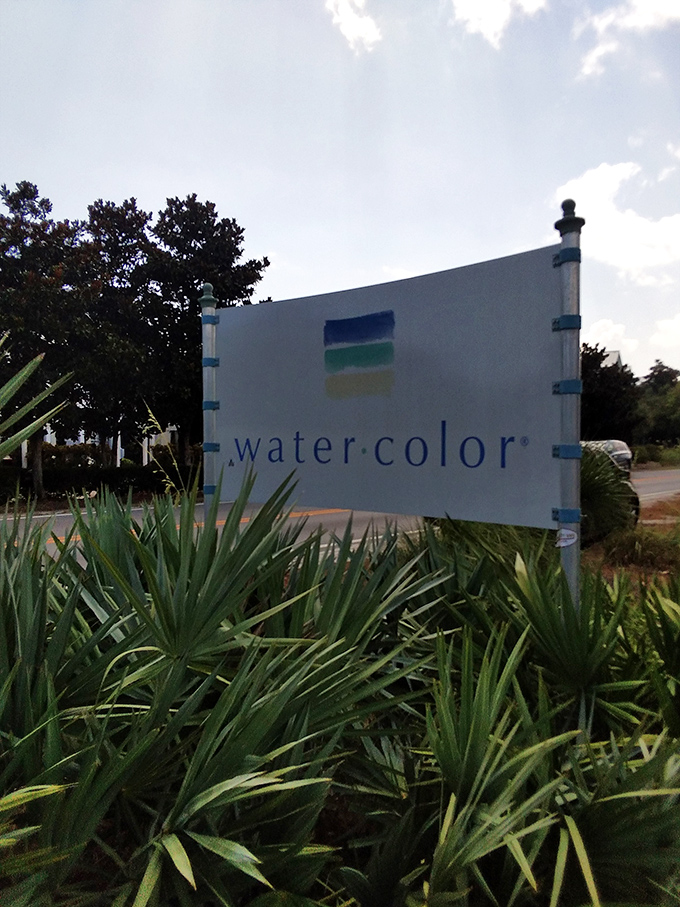 The WaterColor sign, surrounded by native plants &ndash; your official notification that stress ends here and relaxation begins immediately.