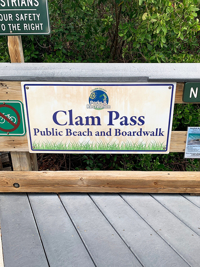 The welcoming sign to Clam Pass Beach Park promises adventures beyond the boardwalk, where Collier County's natural treasures await discovery.