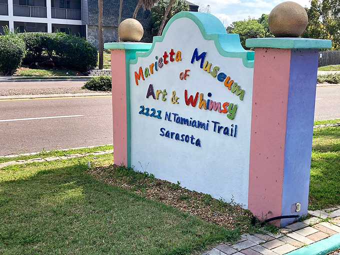 The museum's cheerful signage serves as both wayfinding and the first hint of the color explosion waiting just beyond the entrance.