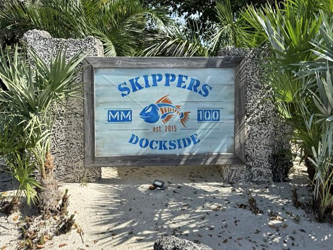 The weathered sign promises exactly what it delivers &ndash; a genuine Keys experience where fresh seafood and waterfront views reign supreme.